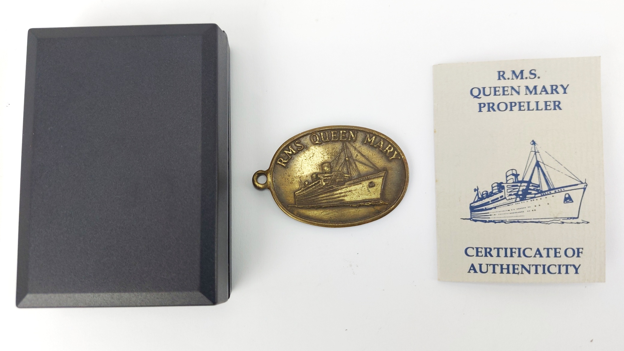 British, c.1990s, RMS Queen Mary Propeller Relic Medallion, with ...